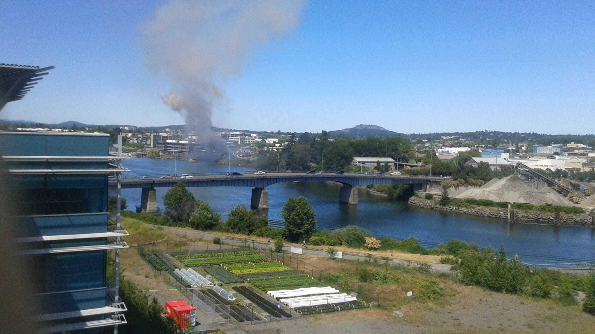 Photos and videos of a barge fire in the Gorge Waterway