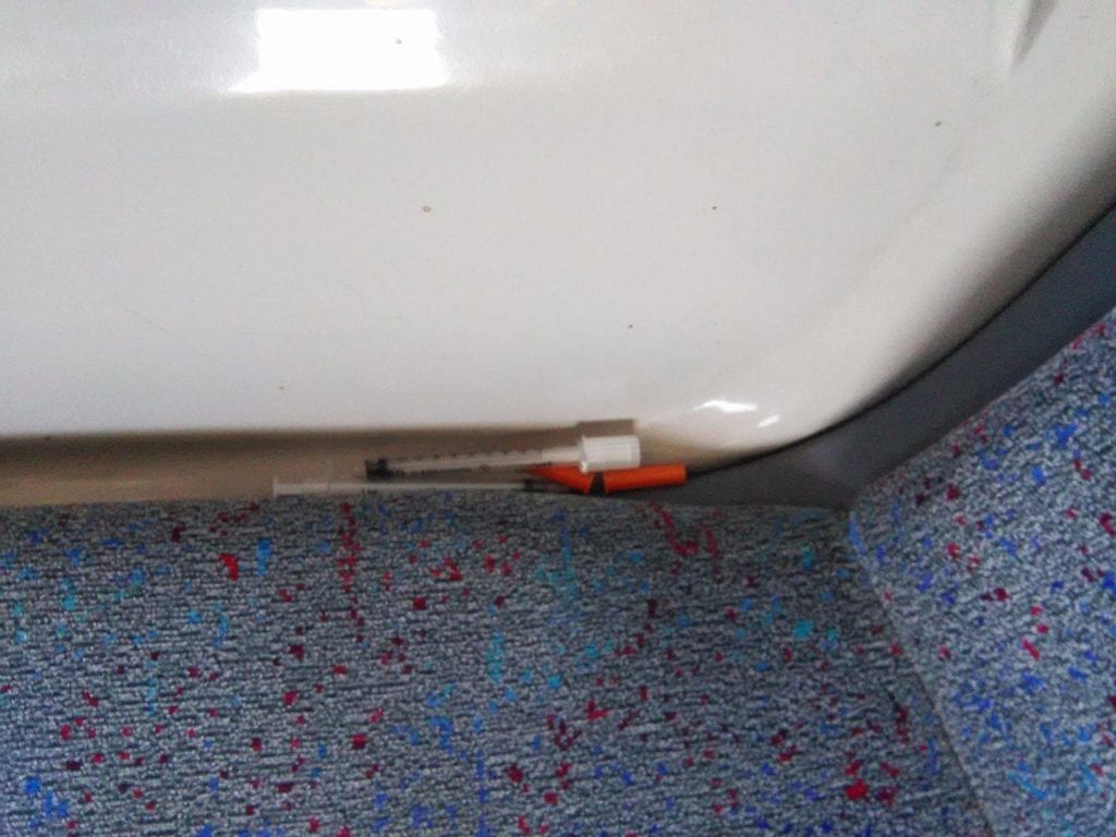 Transit commuter posts a "heads up" warning after finding needles on bus