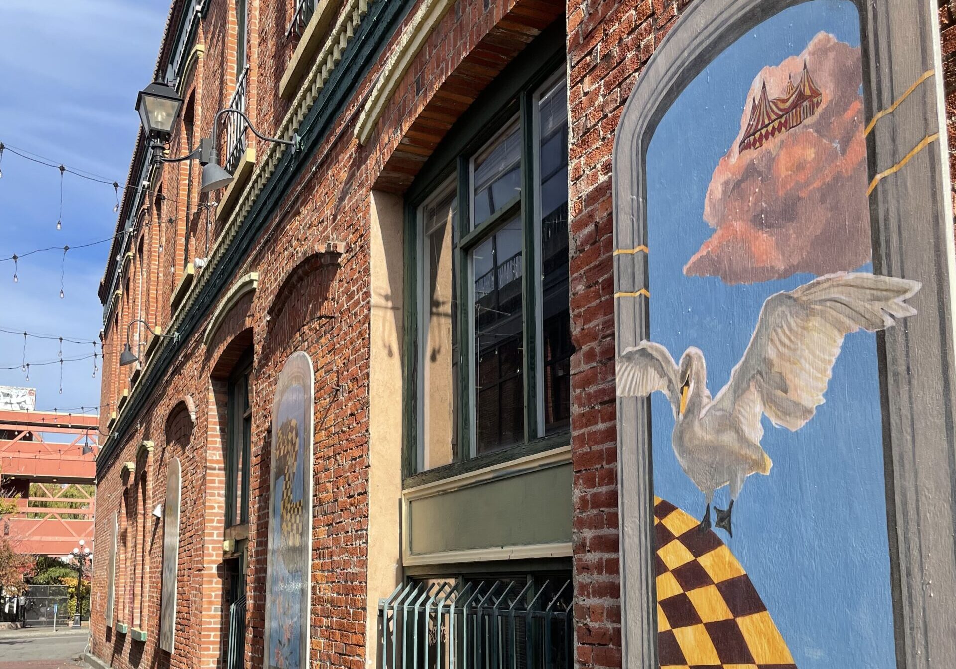 Victoria-based artist reveals striking mural in downtown's Commercial Alley